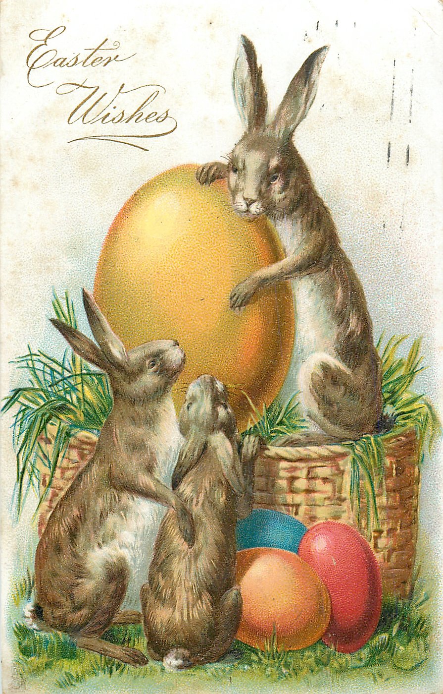 EASTER WISHES three rabbits on & in front of basket, with colored eggs ...